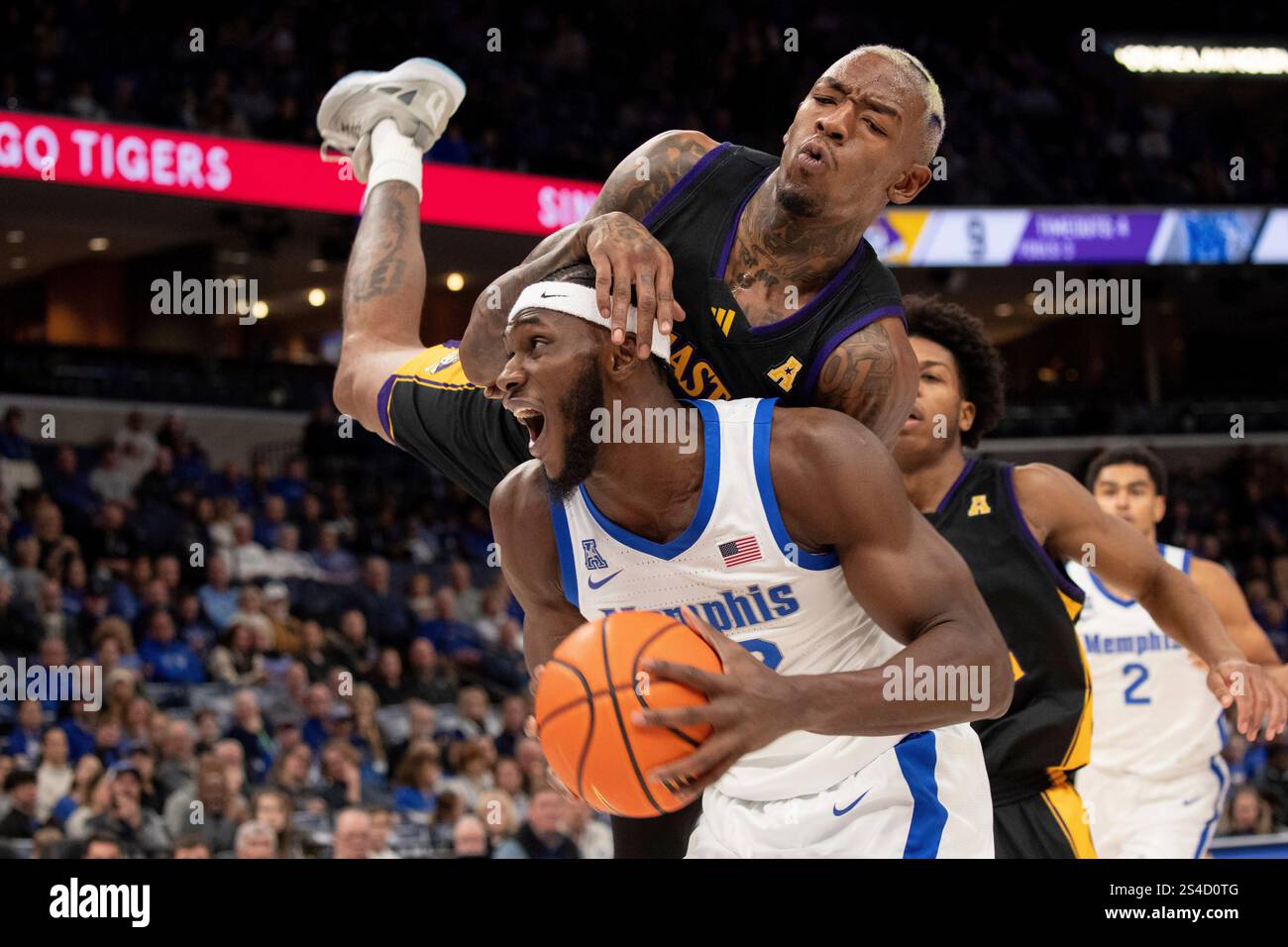 Memphis center Moussa Cisse (32) moves to shoot the ball as East Carolina forward C.J. Walker ...