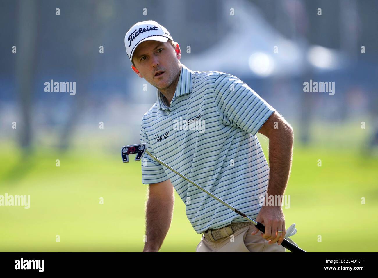 Russell Henley watches his shot on the first hole during the third ...
