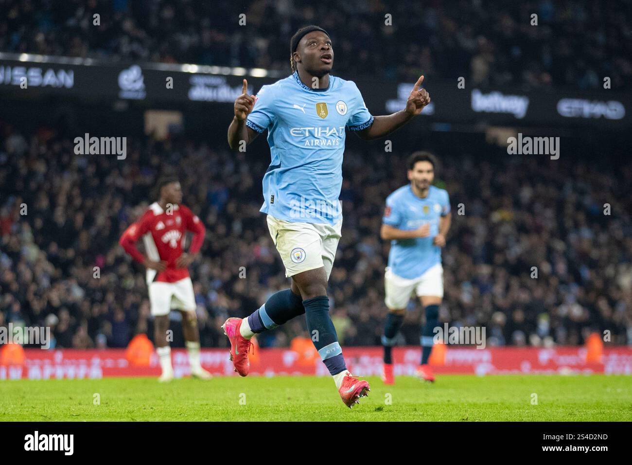 Jeremy Doku #11 of Manchester City F.C. celebrates his goal during the ...