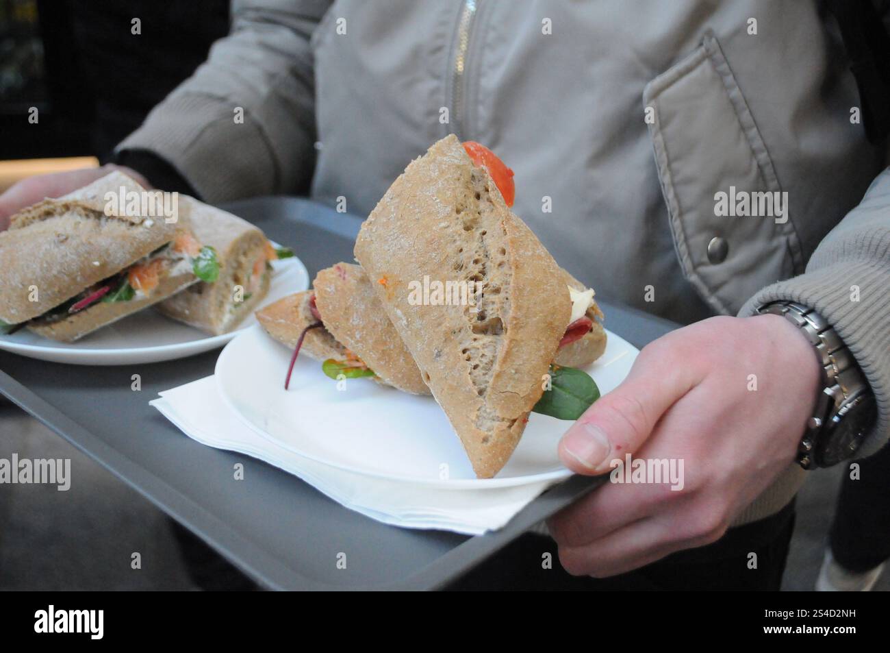 Copenhagen/ DenmarK/11 JANUARY 2025/ prson with sandiwcih tray in ...