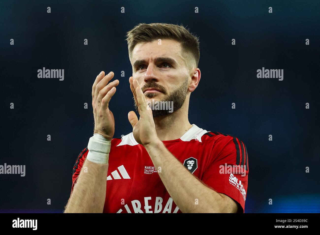 Luke Garbutt of Salford City applauds the fans at the end of the ...