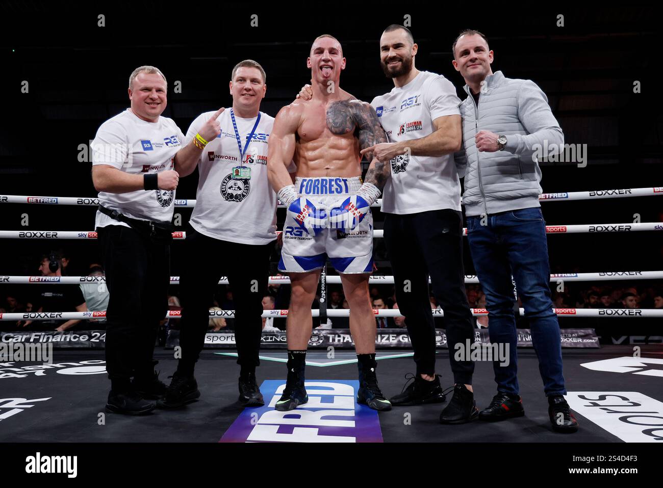 Scott Forrest (centre) celebrates with his team after winning the ...