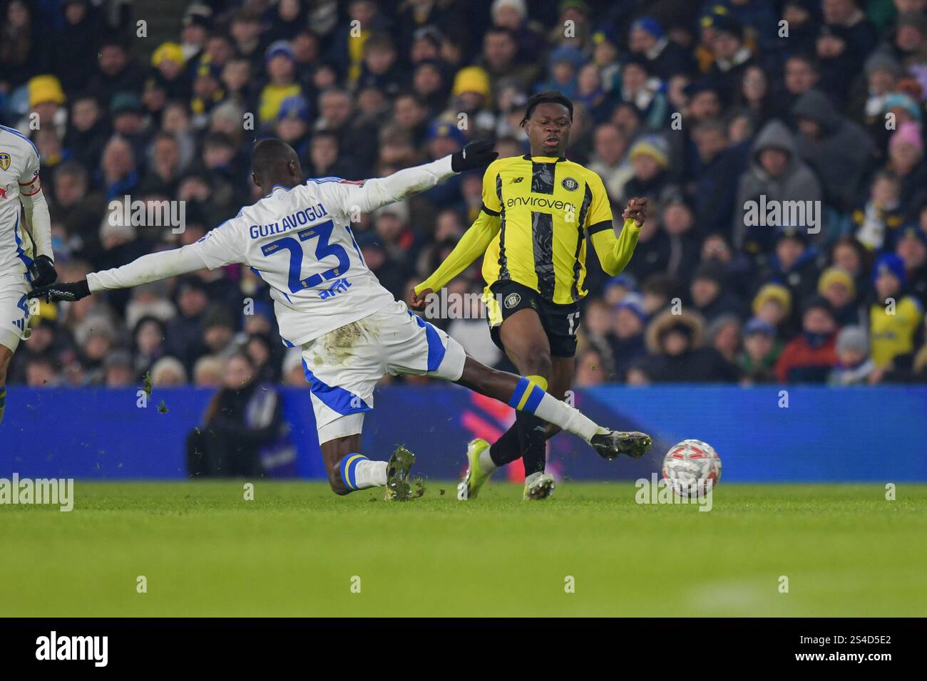 Harrogate Town's Sam Folarin looks to get past the sliding tackle of ...