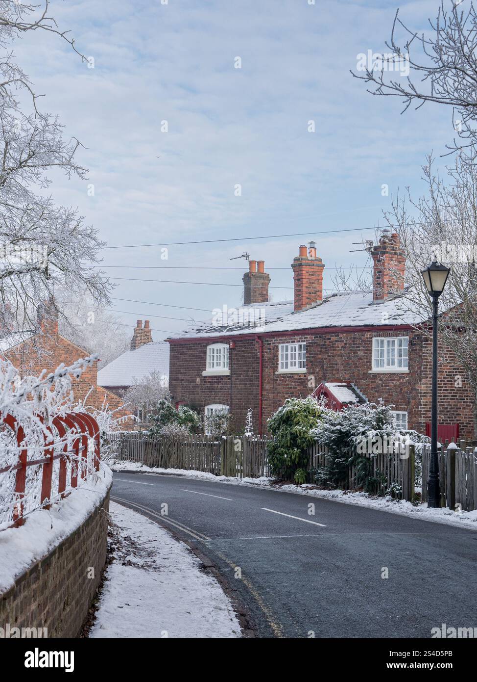 A picturesque village during the winter. Snowfall, snow, ice and bitter ...