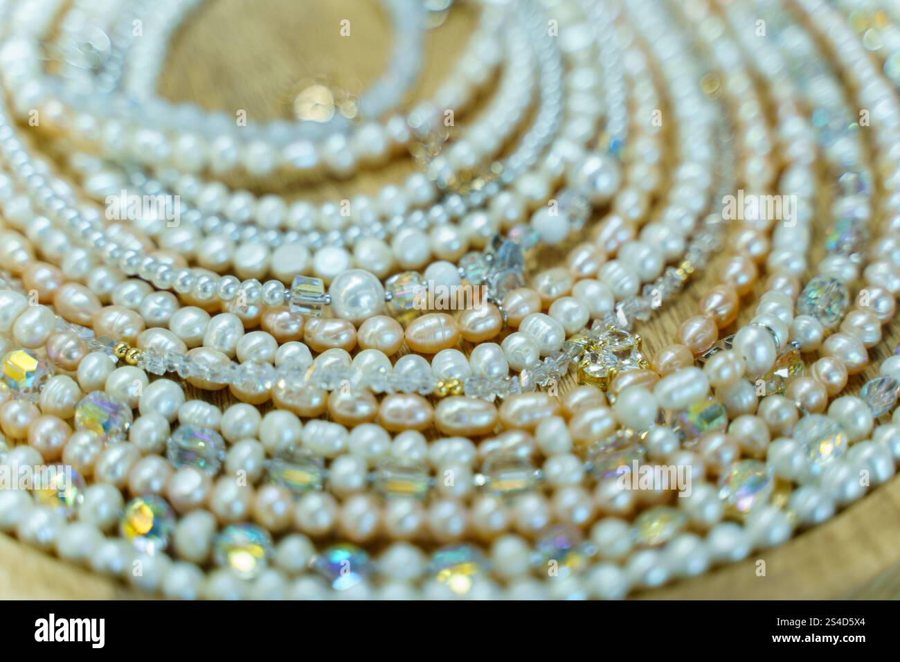 Delicate strands of lustrous pearls and crystals create a beautiful ...