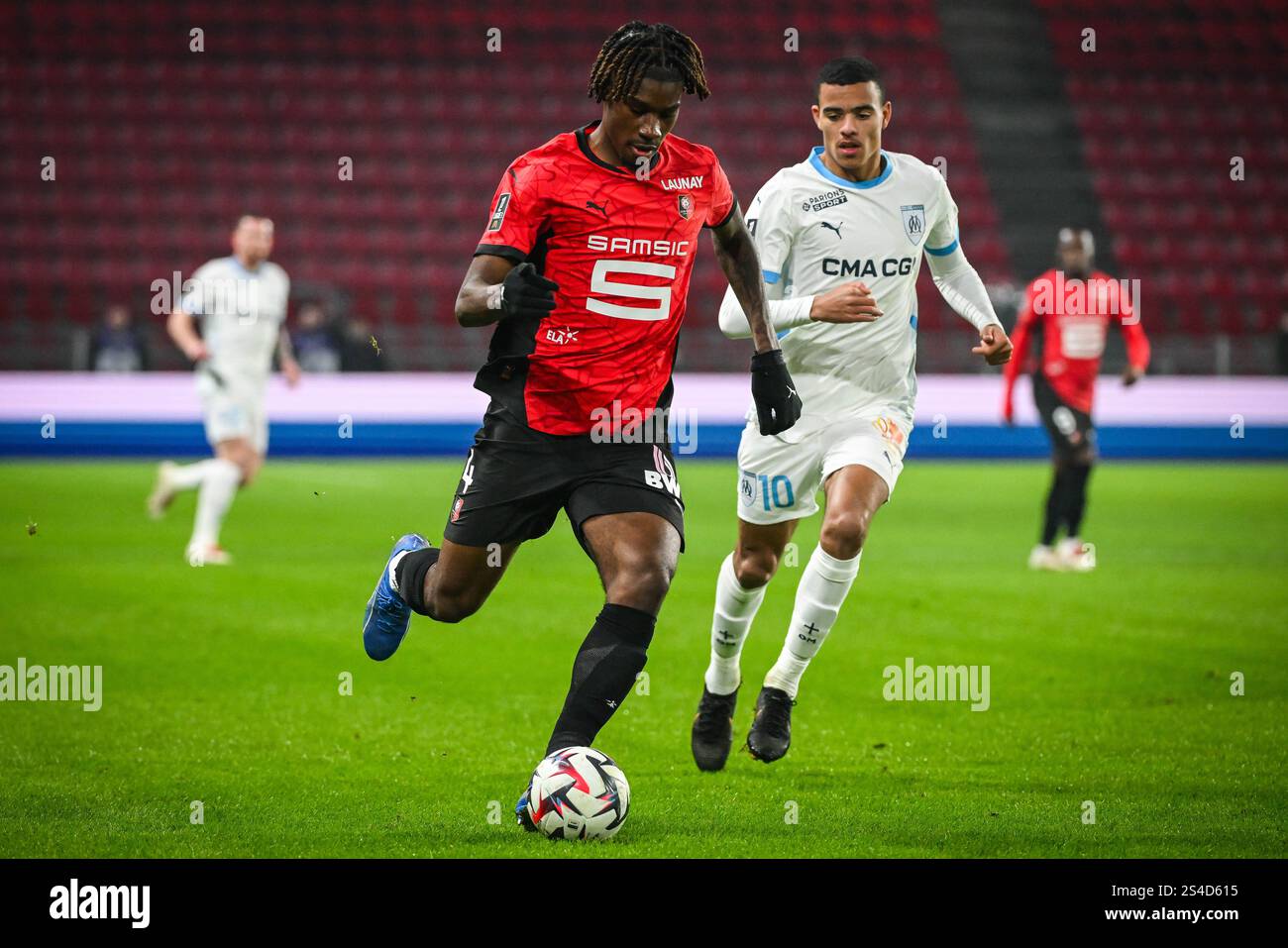 Christopher WOOH of Rennes and Mason GREENWOOD of Marseille during the ...