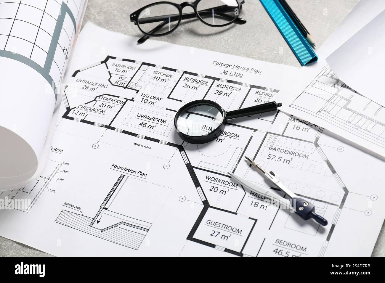 Different engineering drawings and tools on grey table Stock Photo - Alamy