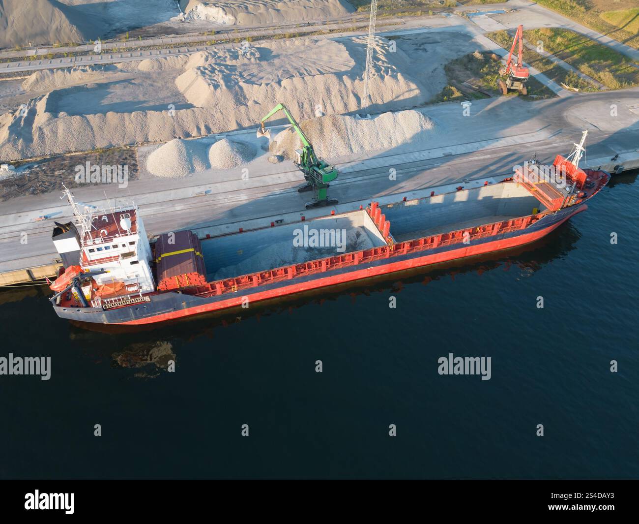 Drone view: a bulk carrier takes on tons of crushed stone at the port ...