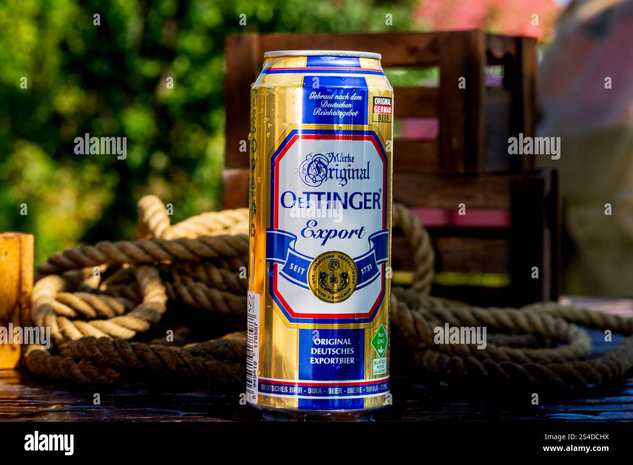 Oettinger beer can - condensation water droplets, outdoors background ...