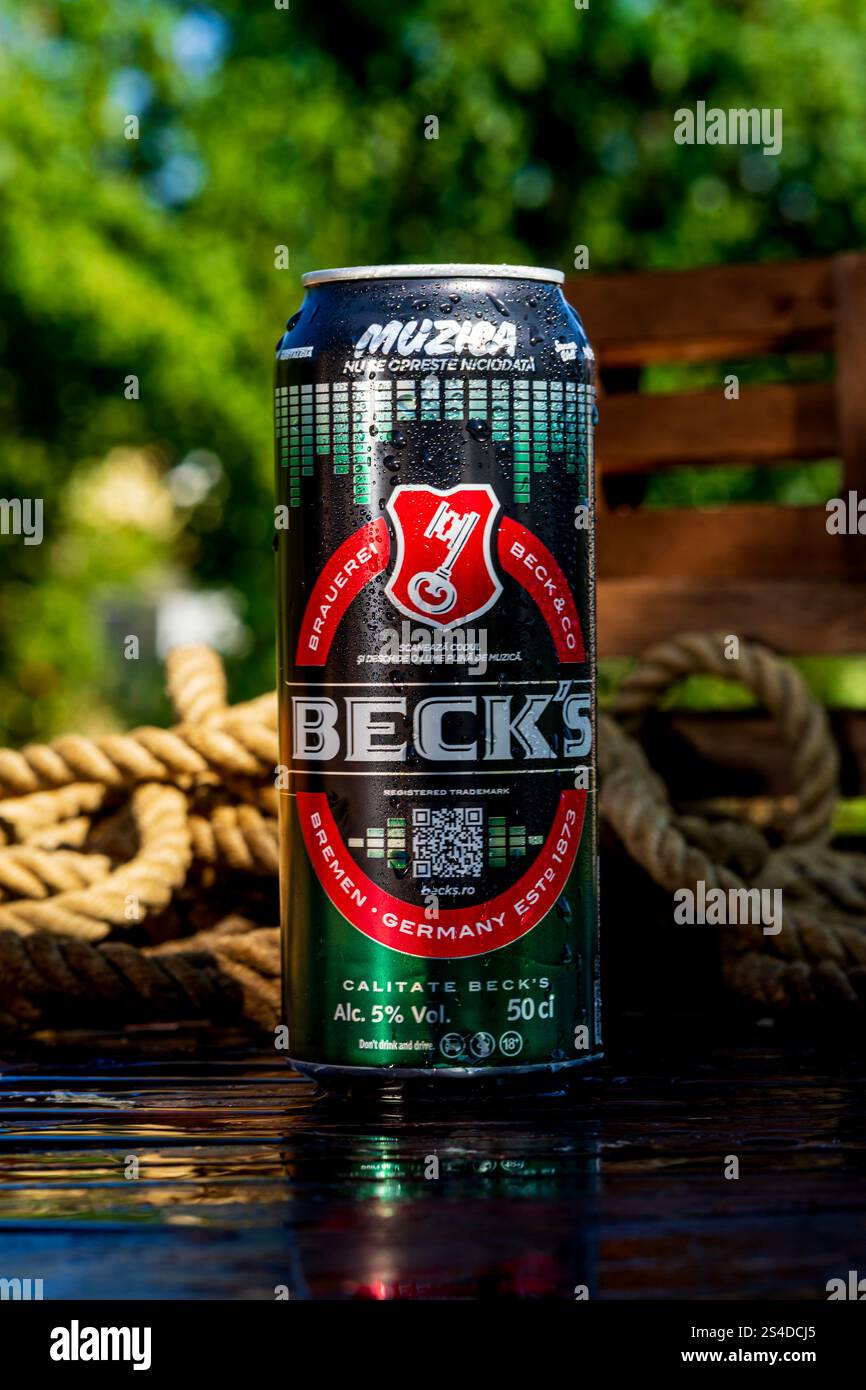 Beck's beer can - condensation water droplets, outdoors background ...