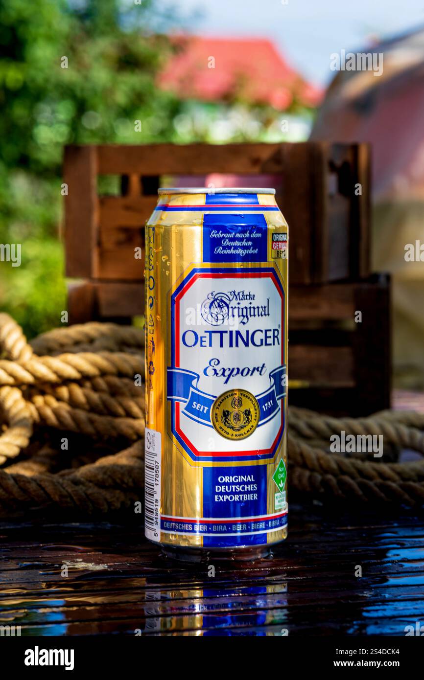 Oettinger beer can - condensation water droplets, outdoors background ...