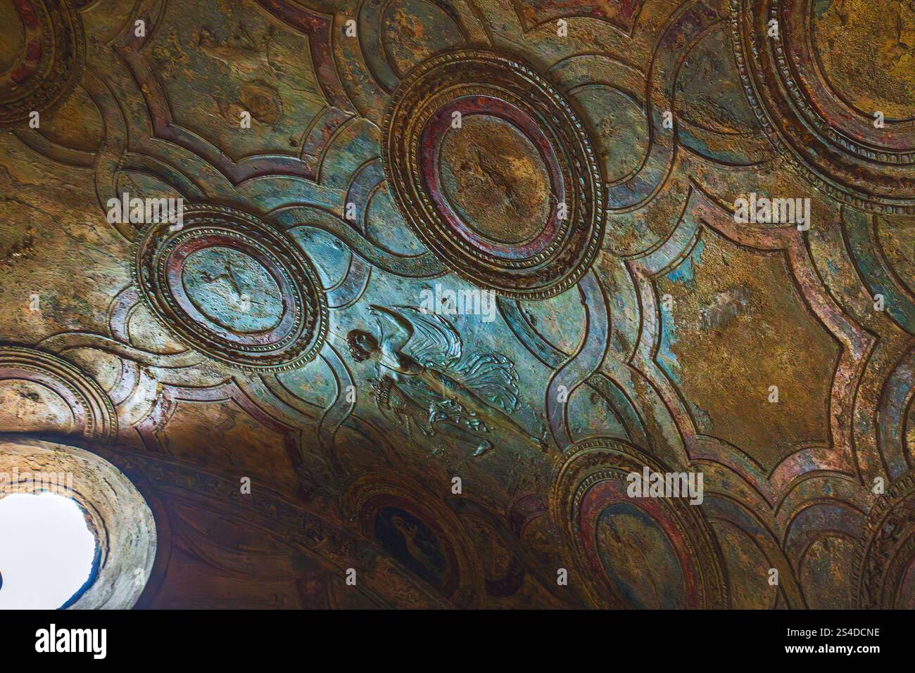 Explore the vibrant ceiling art with intricate circular patterns and ...