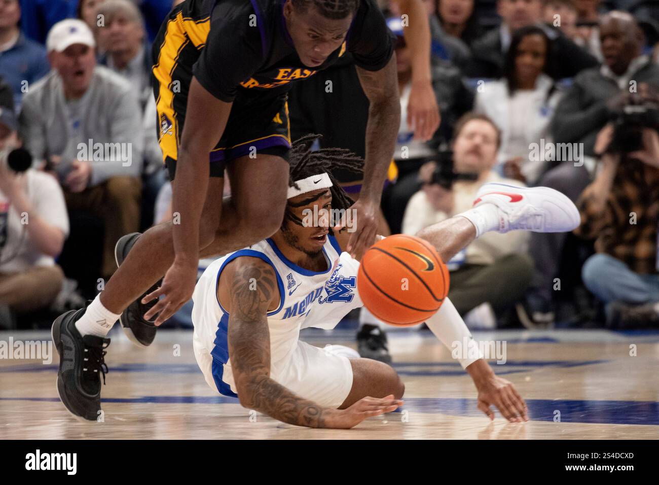 East Carolina guard Cam Hayes, left, and Memphis guard Colby Rogers ...