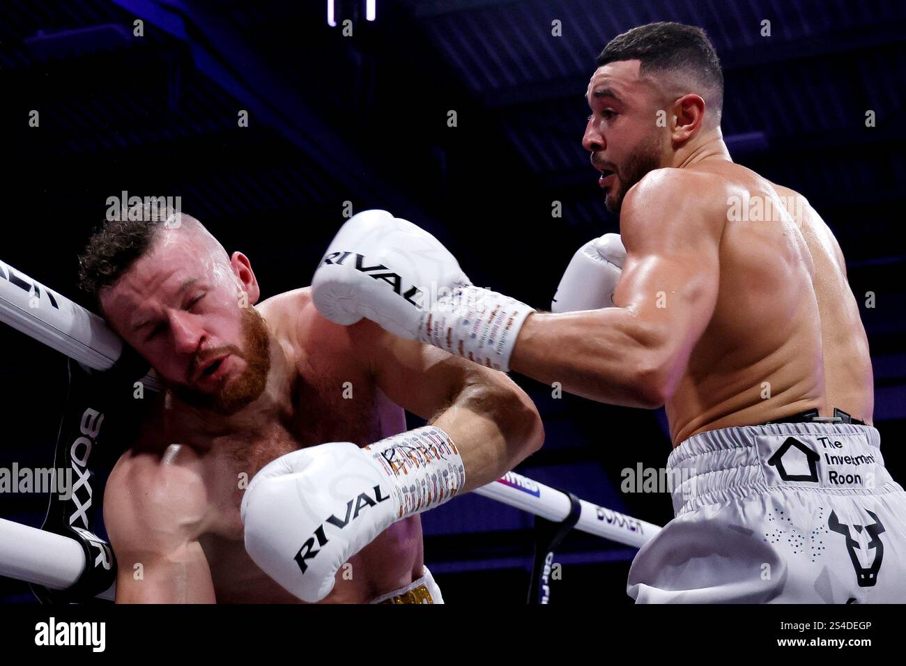 Steed Woodall is knocked down by Callum Simpson (right) during the ...