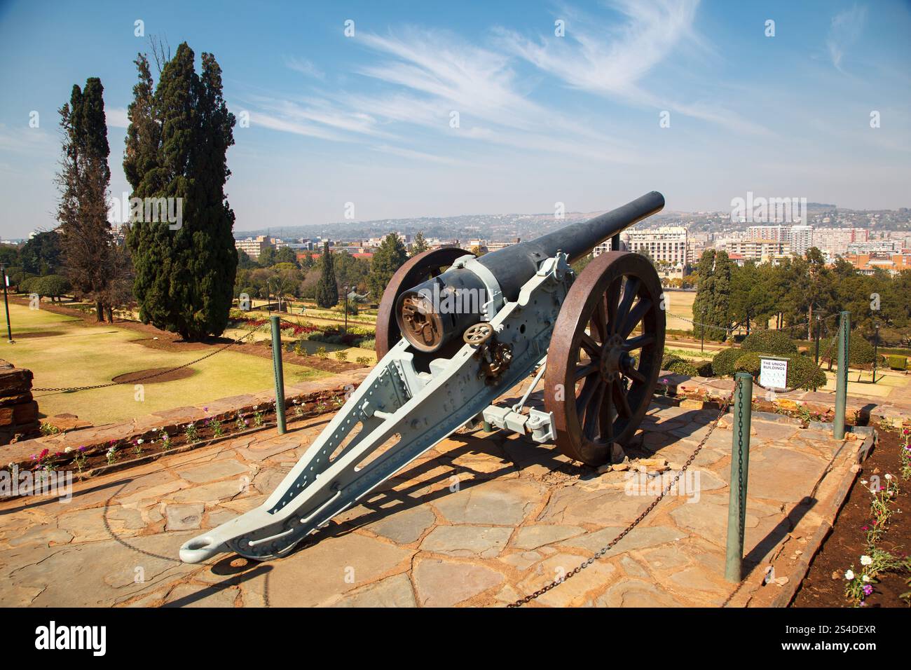 A Vintage artillery cannon and the terraced Union Buildings Gardens ...