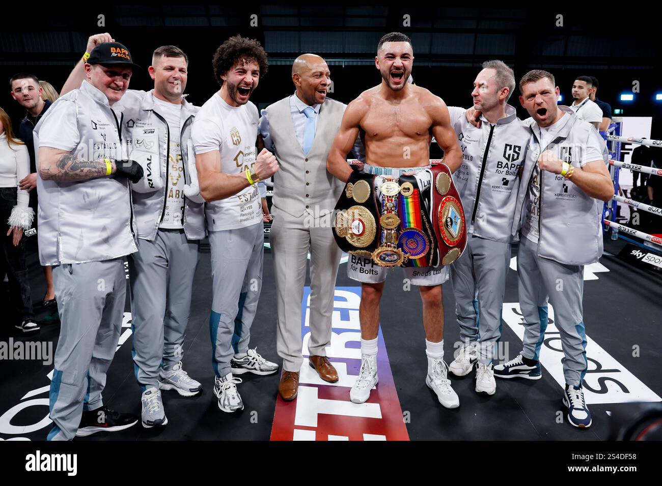 Callum Simpson (centre right) celebrates with his team after winning ...
