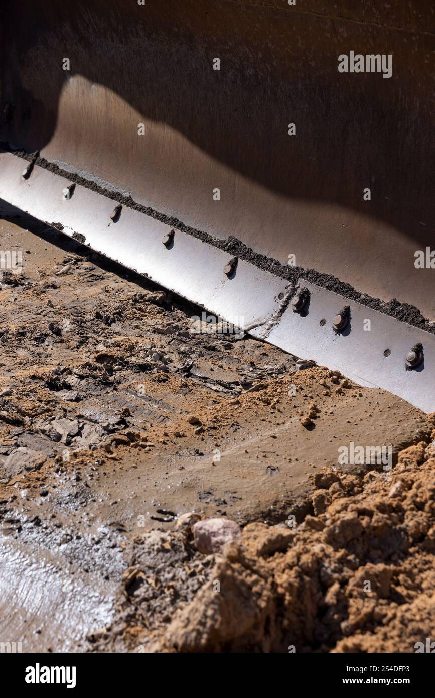 construction work during the excavation of a pit for laying different ...