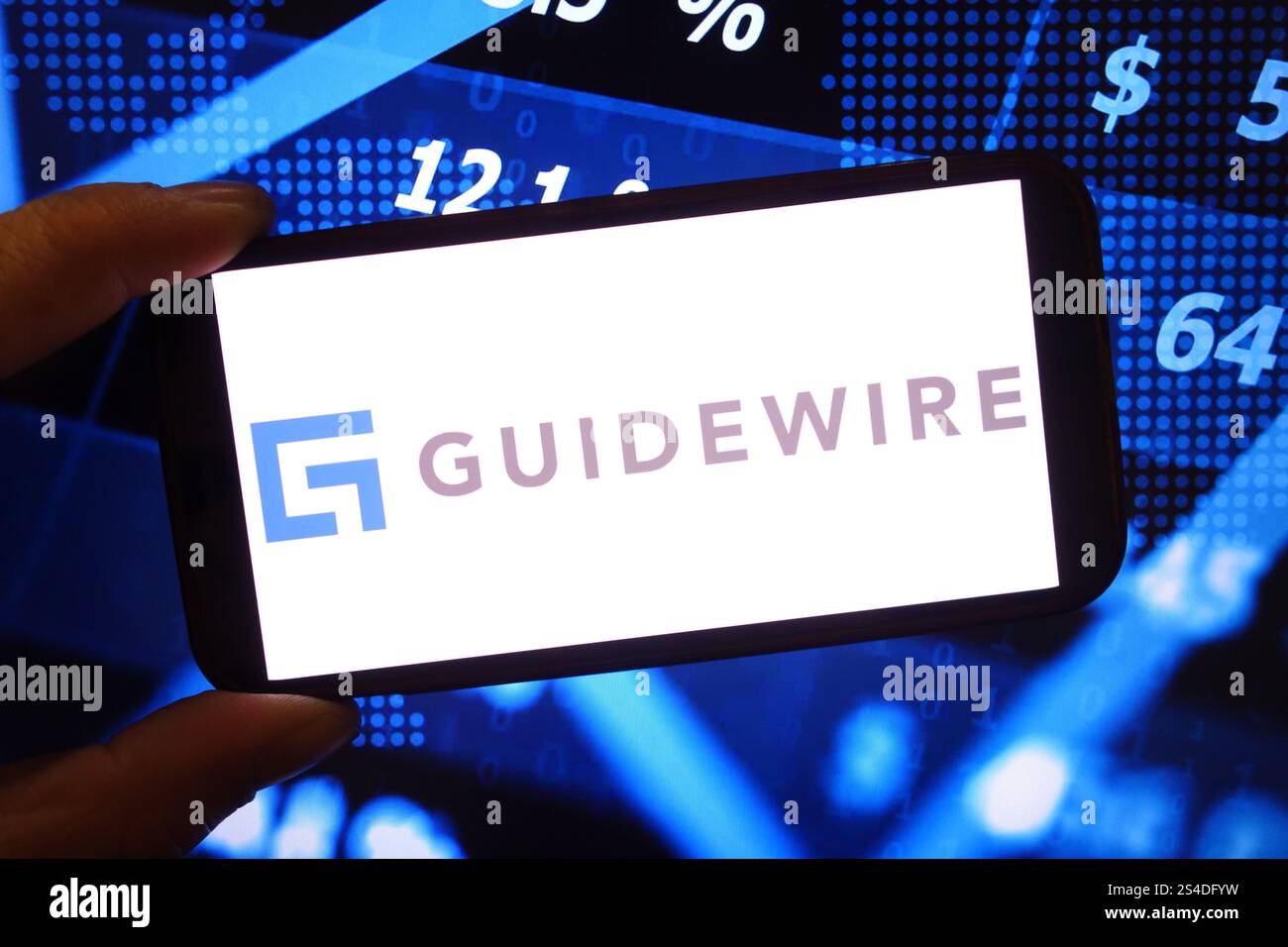 In this photo illustration, the Guidewire Software company logo is seen displayed on a ...