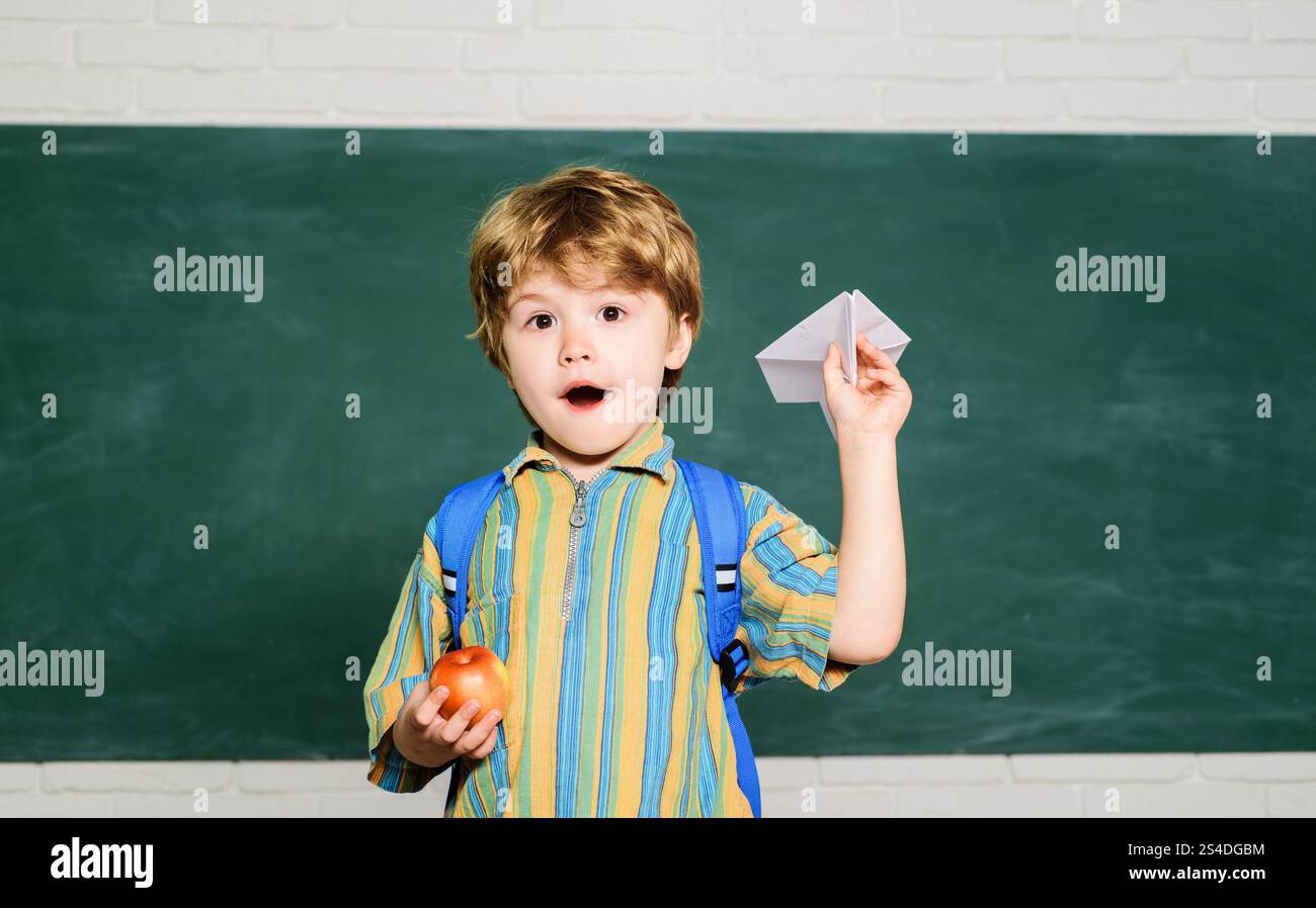 School education. Origami lesson in school. Elementary school boy ...