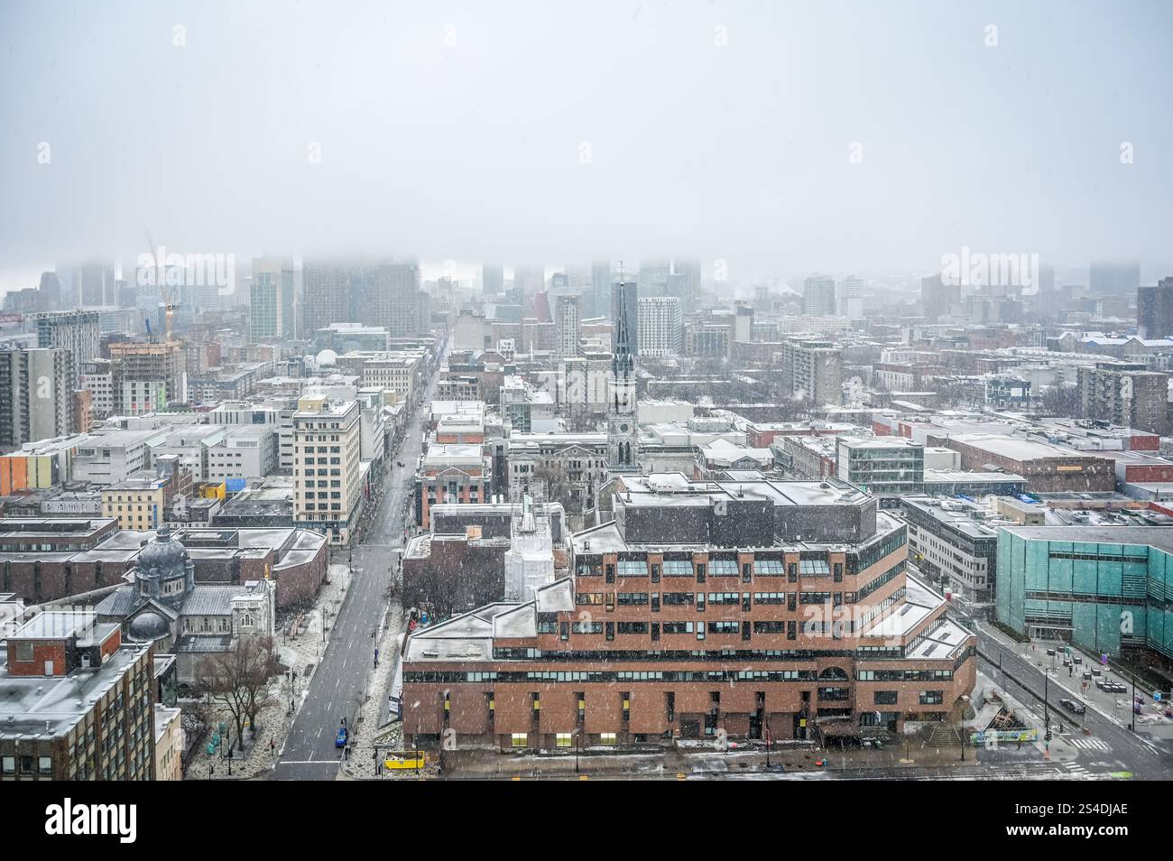 Aerial view of winter cityscape with snowfall and Fog, downtown ...