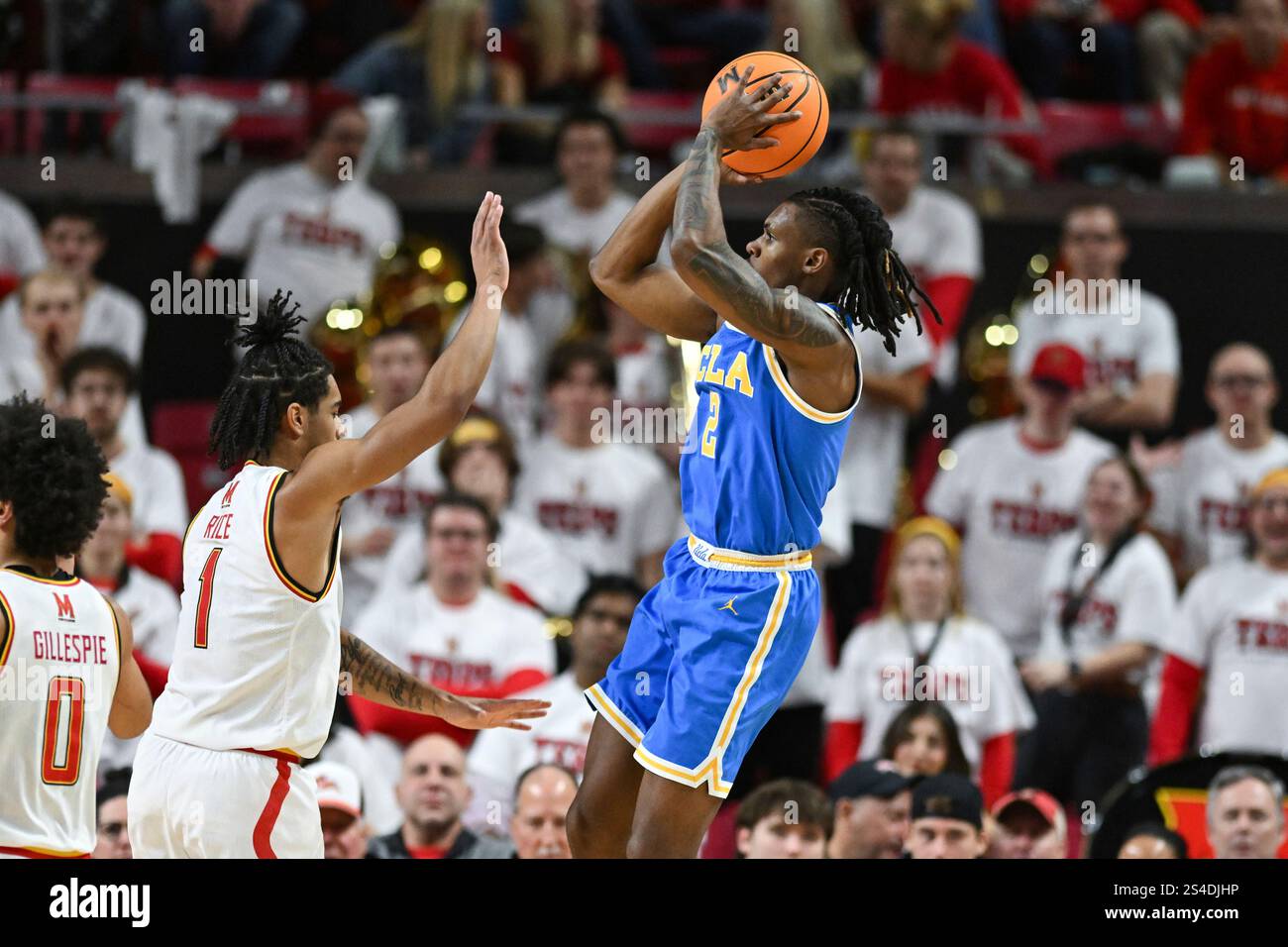 UCLA guard Dylan Andrews (2) shoots the ball over Maryland guard Rodney ...