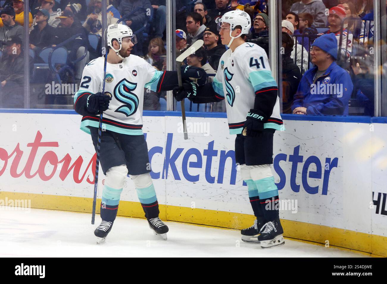 Seattle Kraken defenseman Ryker Evans (41) celebrates with right wing ...