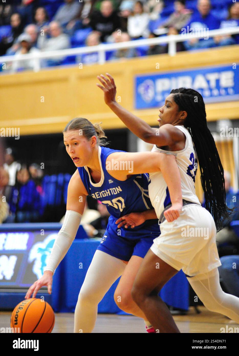 South Orange, USA. 11th Jan, 2025. Creighton's Morgan Maly (30) drives past Amari Wright (22 ...