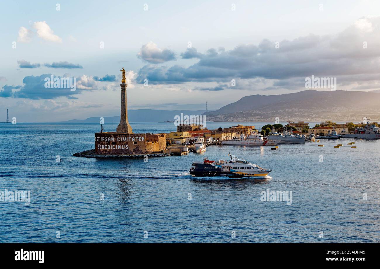 The Golden Madonna della Lettera statue and Liberty Lines Ferry in ...
