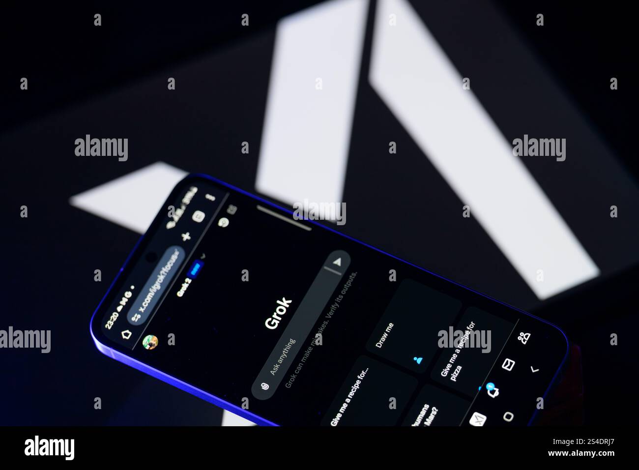 Grok AI application is displayed on a mobile phone with X AI icon seen ...