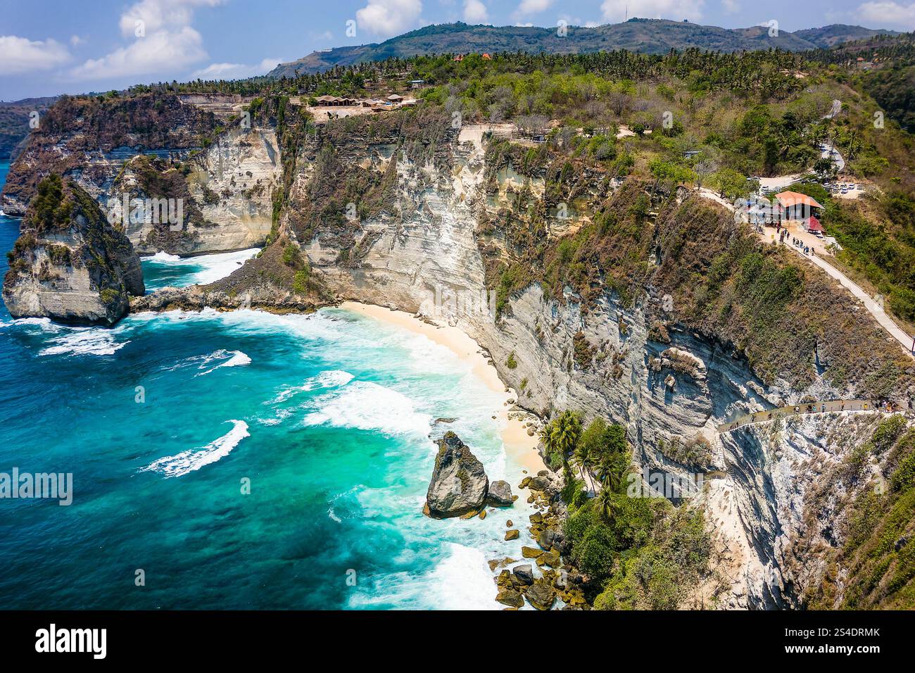 Tropical ocean waves crashing into a small beach and spectacular ...