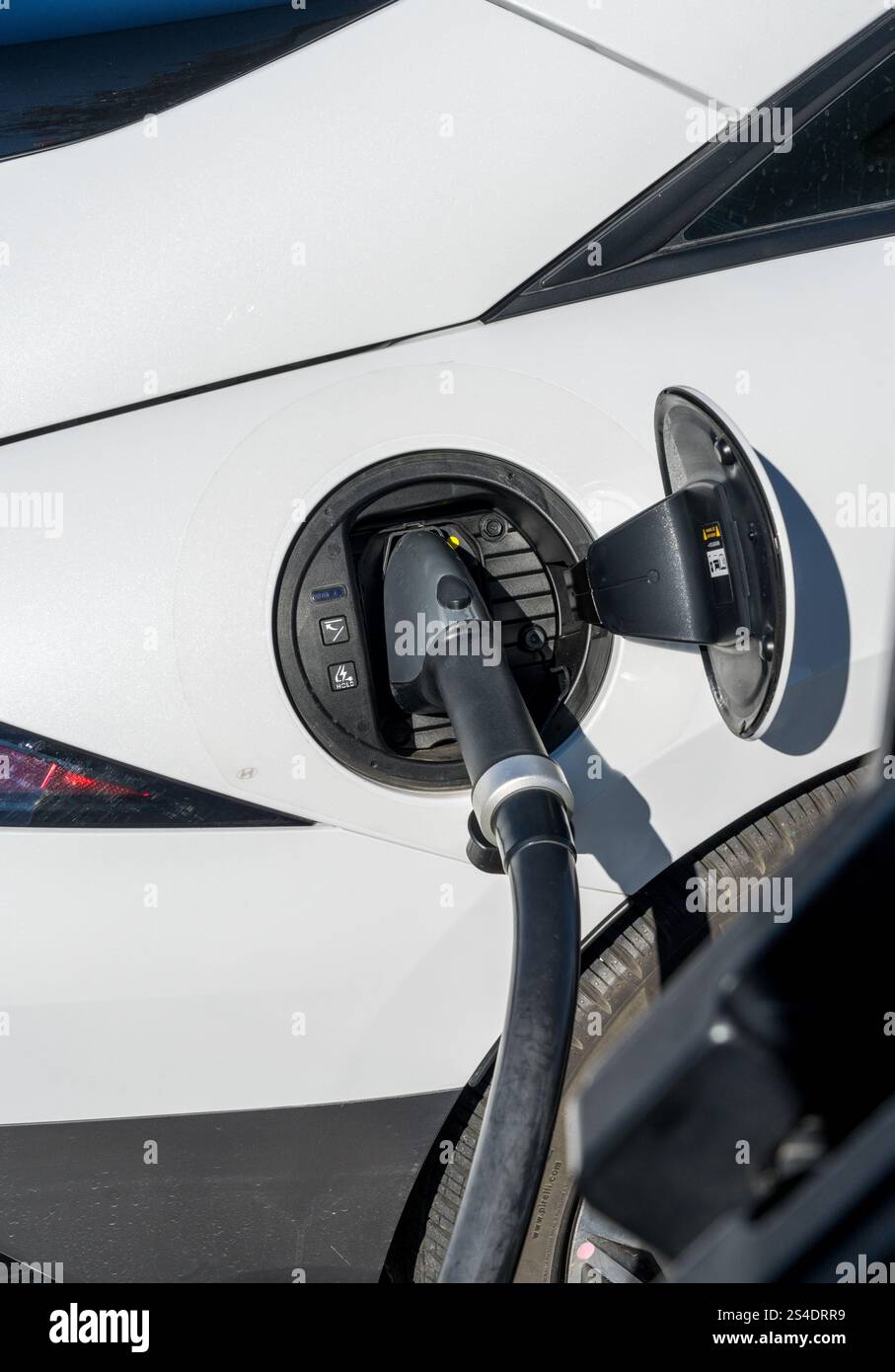 Modern electric car connected to DC high speed charger at public ...