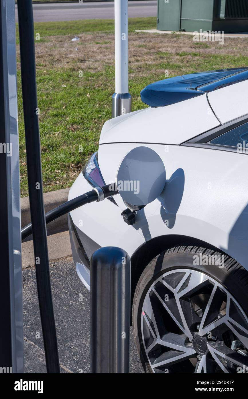 Modern electric car connected to DC high speed charger at public ...