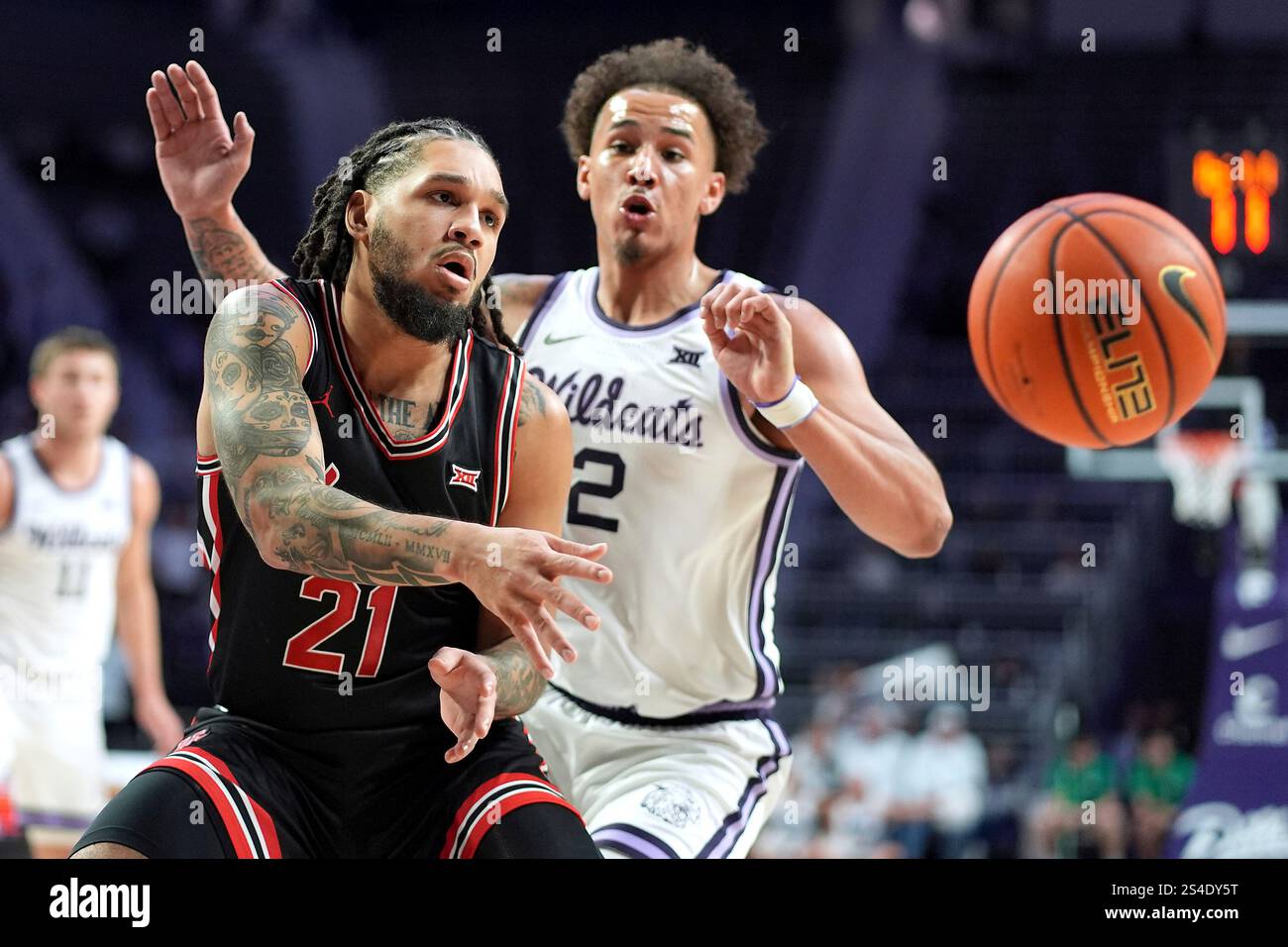 Houston guard Emanuel Sharp (21) passes under pressure from Kansas ...