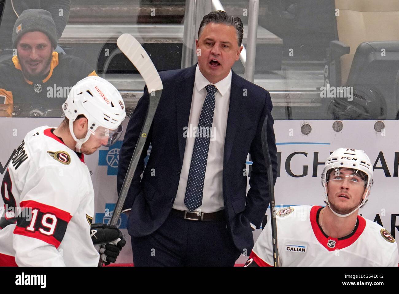 Ottawa Senators head coach Travis Green, center, gives instructions ...
