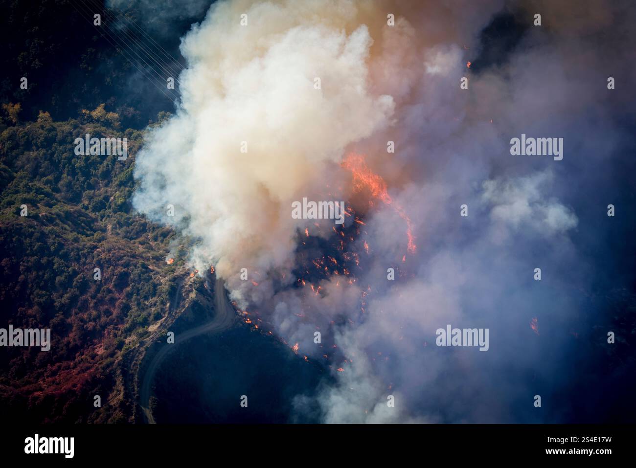 Flames from the Palisades Fire burn along the ridge line near ...