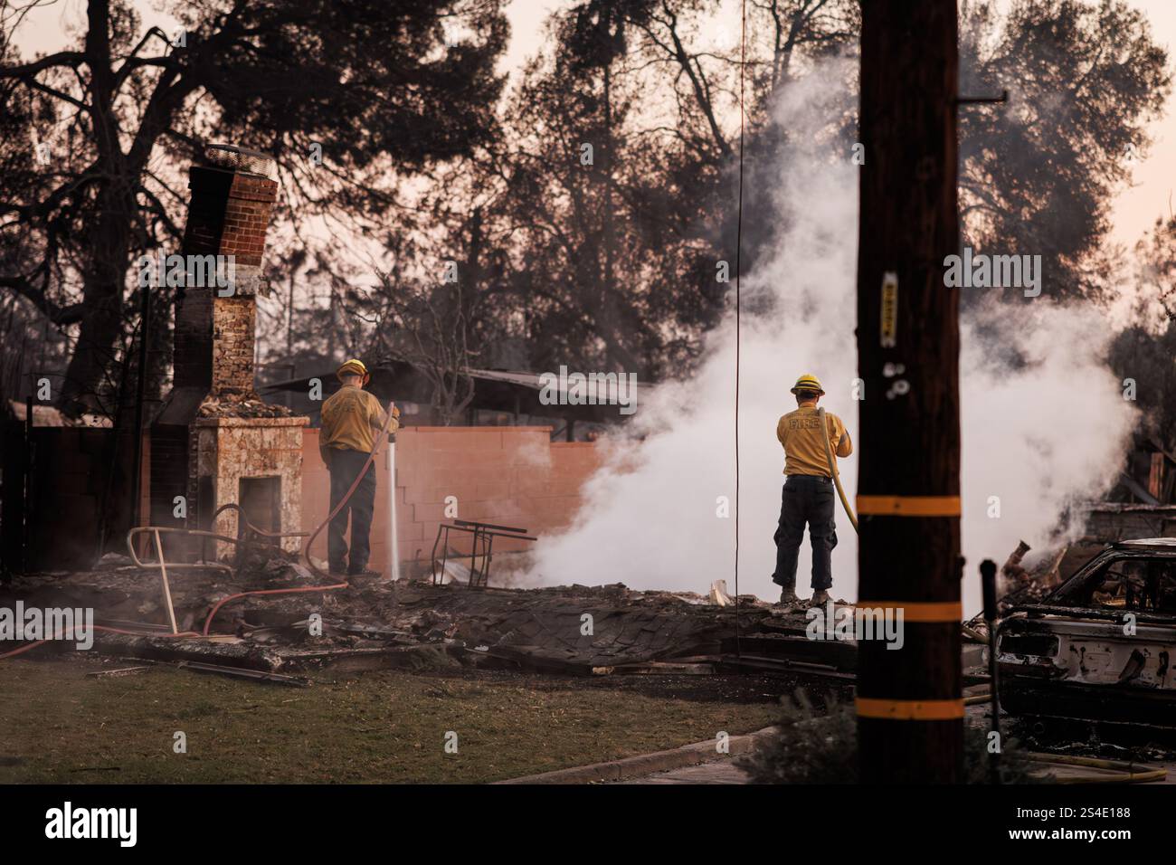 Fire crews work on putting out hotspots in Altadena after the Eaton ...