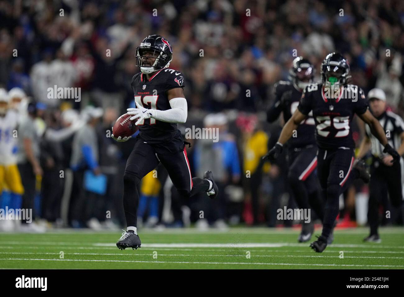 Houston Texans' D'Angelo Ross (37) returns a blocked extra-point ...