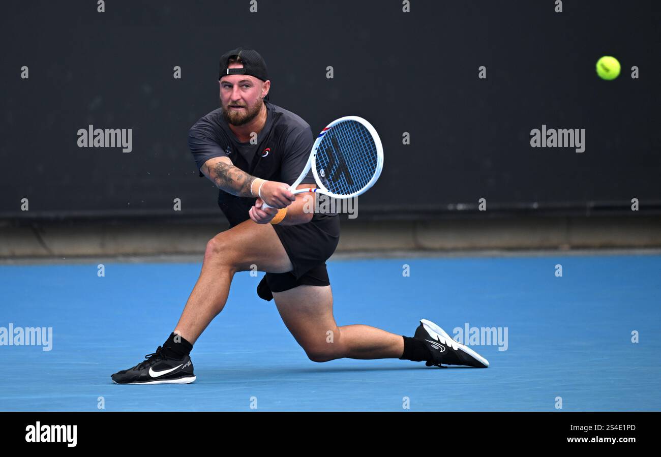 Melbourne, Australia. 12th Jan, 2025. Omar Jasika of Australia returns ...