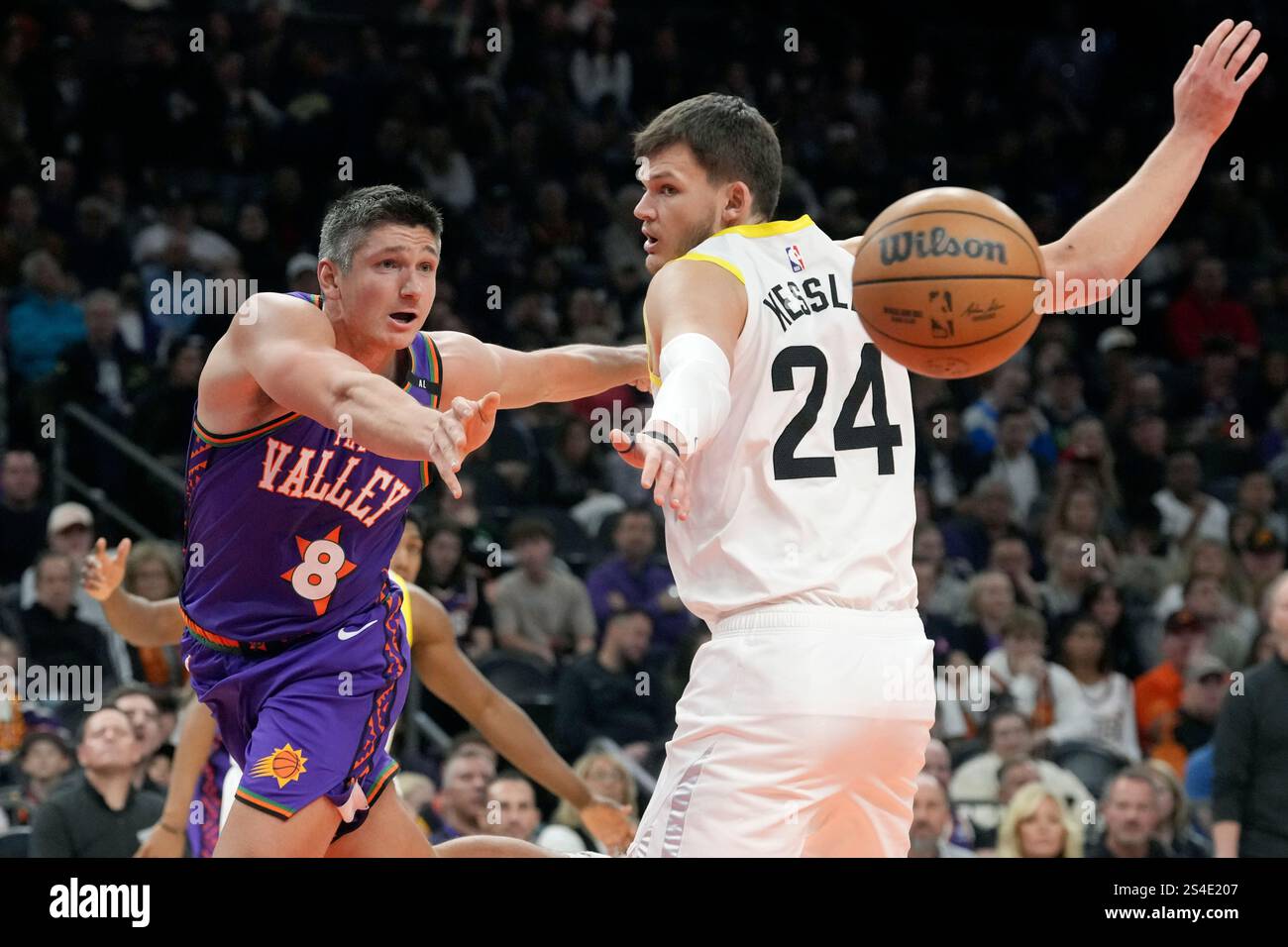 Phoenix Suns guard Grayson Allen (8) passes the ball past Utah Jazz center Walker Kessler (24 ...