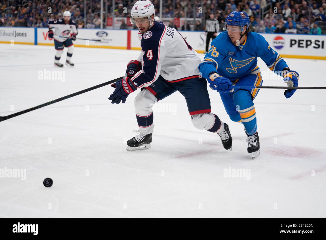 Columbus Blue Jackets' Cole Sillinger (4) and St. Louis Blues' Zack ...