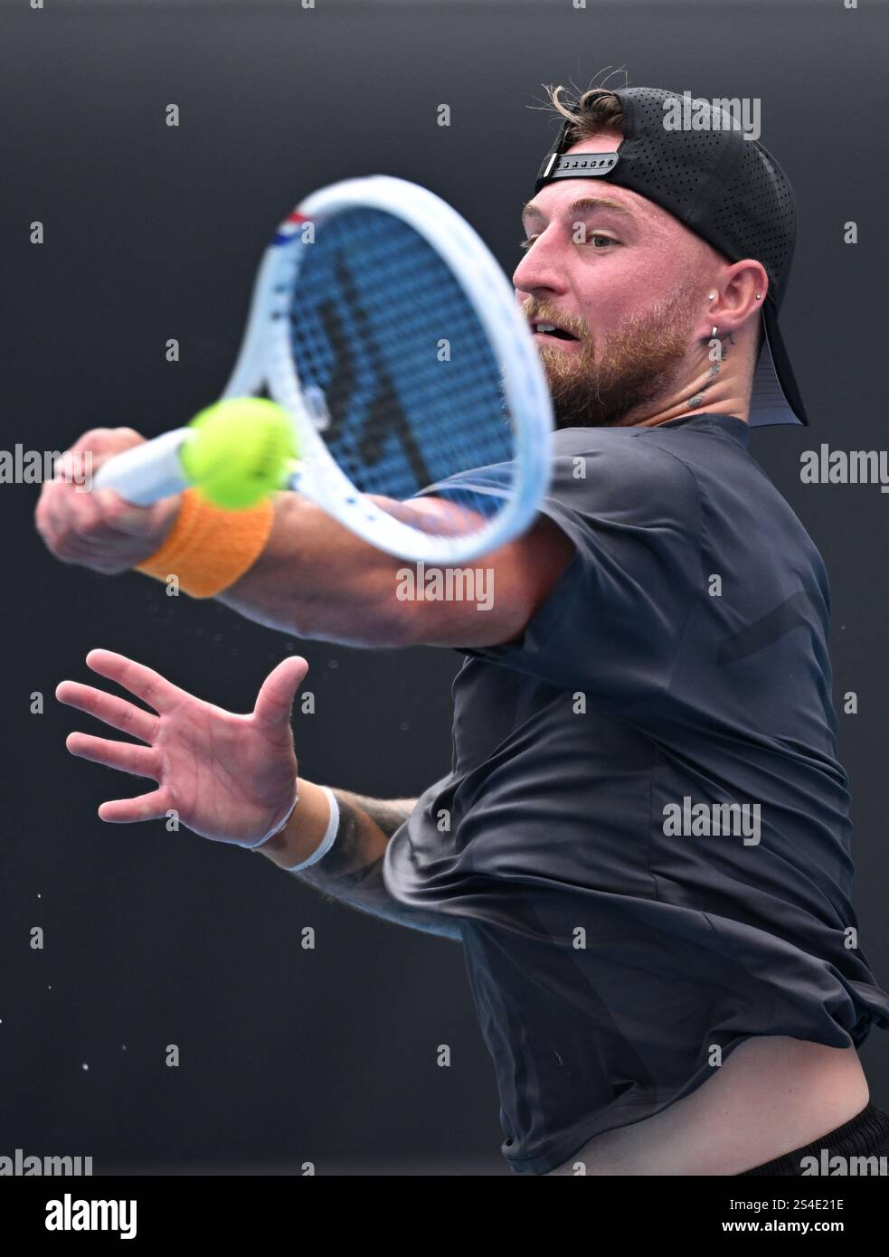 Melbourne, Australia. 12th Jan, 2025. Omar Jasika of Australia returns ...