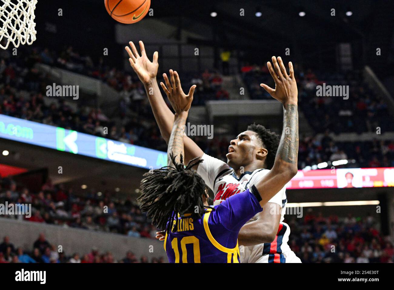 Mississippi forward Malik Dia, right, shoots against LSU forward ...
