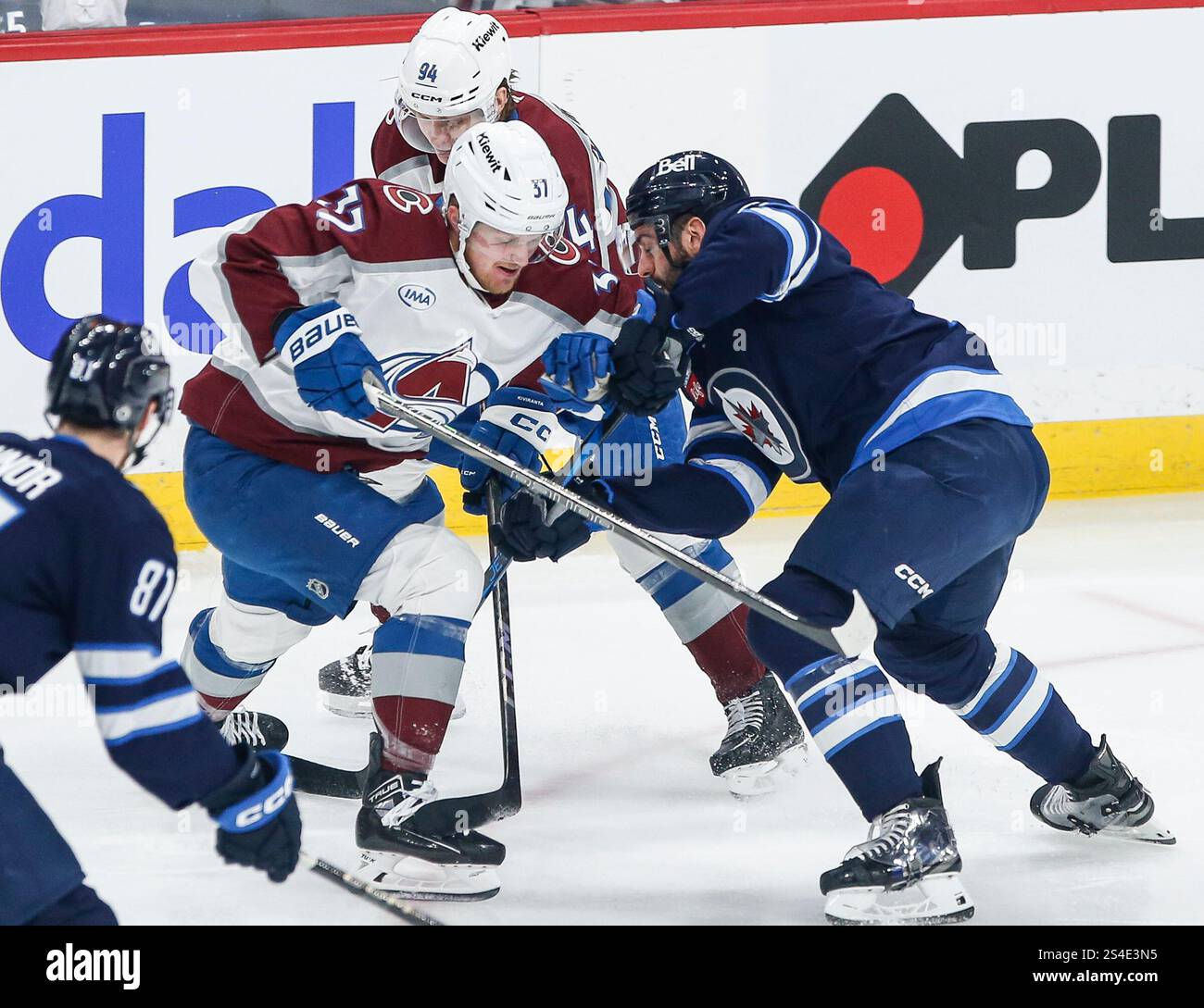 Winnipeg Jets' Dylan DeMelo (right) defends against Colorado Avalanche ...