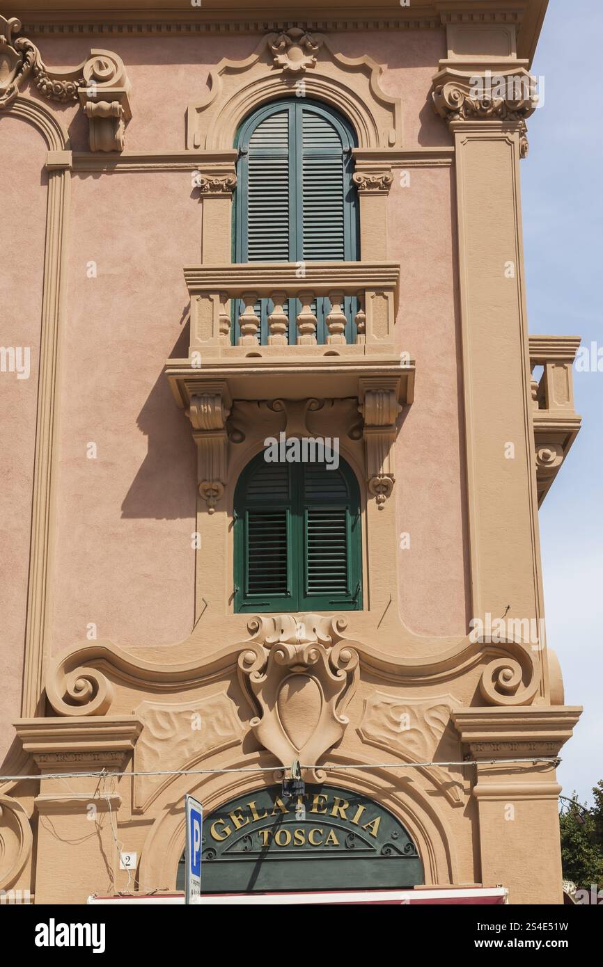 Old beige and tan colored three story architectural building facade ...