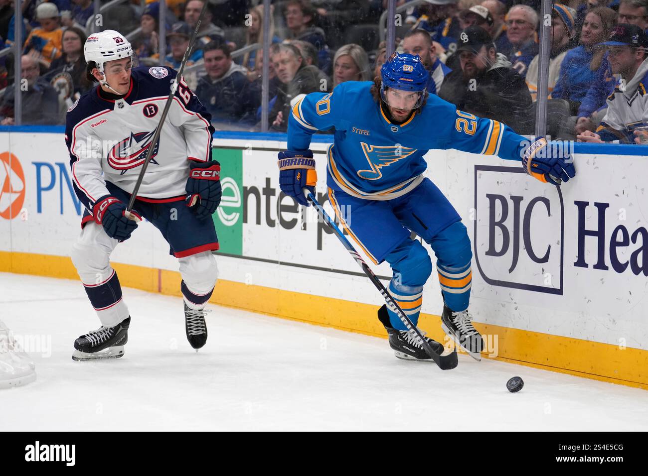 Columbus Blue Jackets' Luca Del Bel Belluz (65) and St. Louis Blues ...