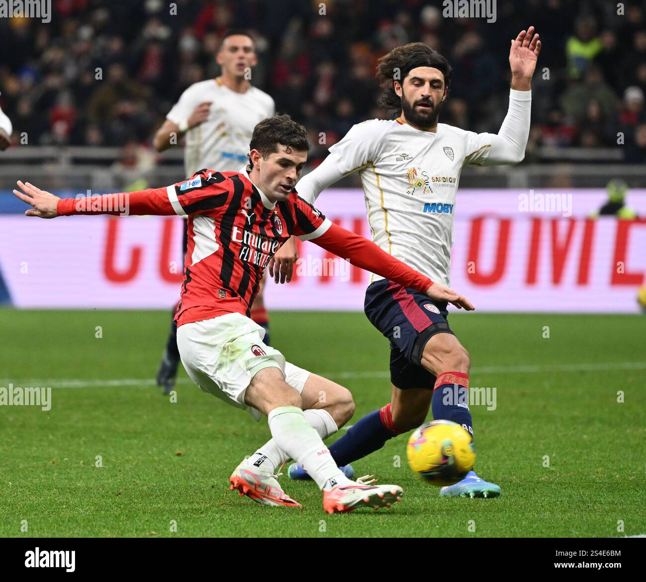 Milan, Italy. 11th Jan, 2025. AC Milan's Christian Pulisic (L) vies ...