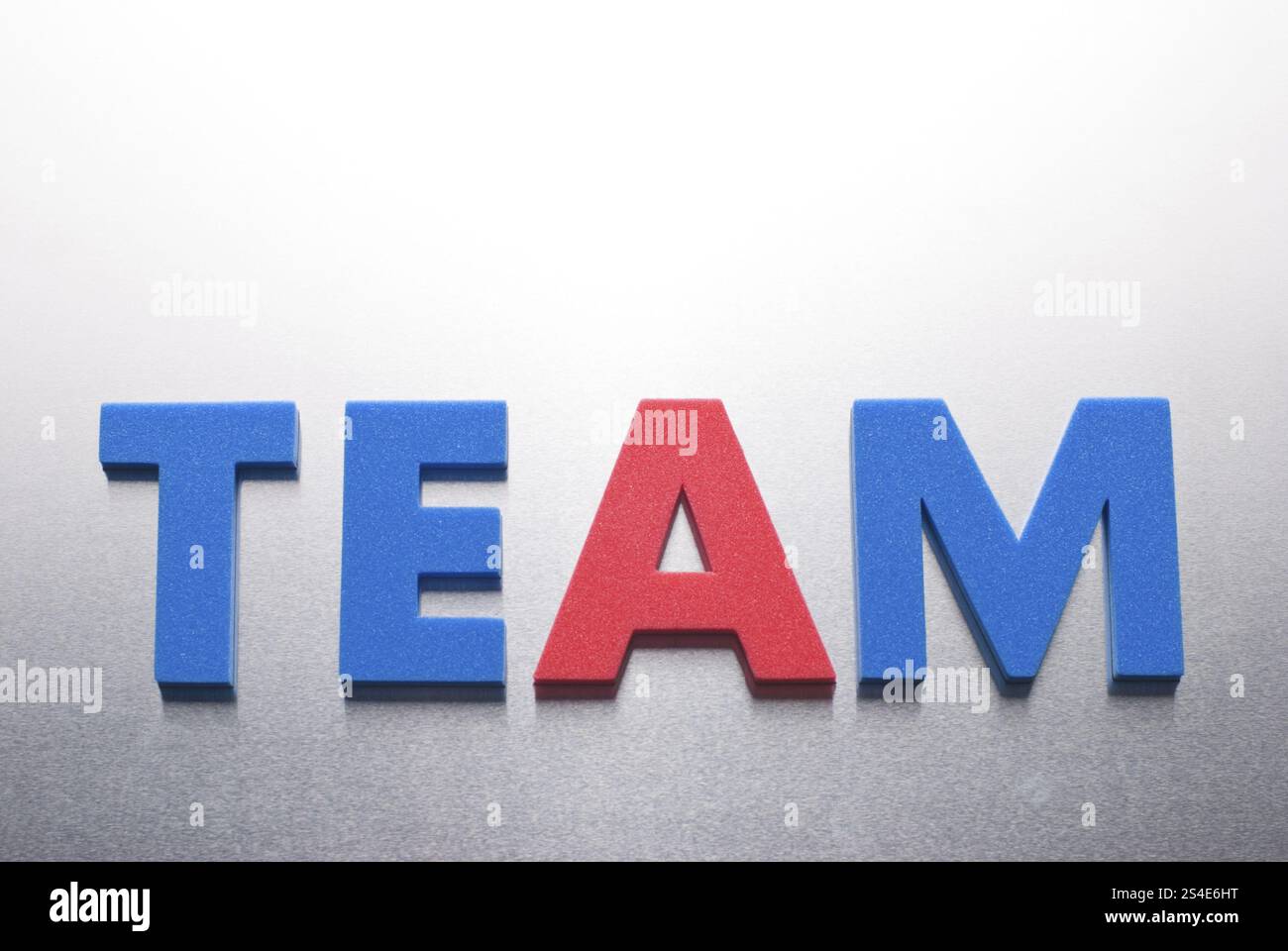 Team word on metal background, part of a series of business words Stock ...