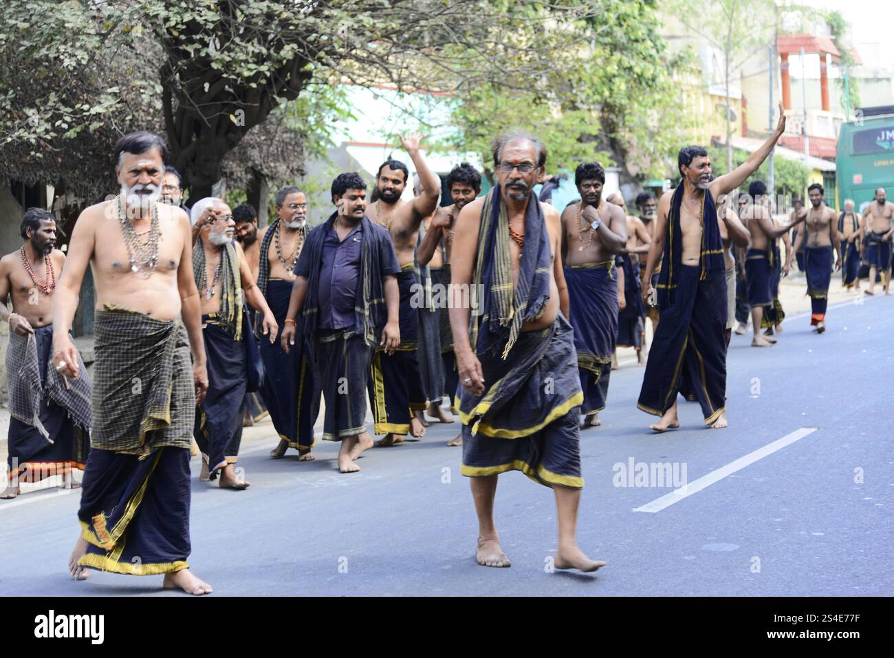 Pilgrims, devotees on their way to the Vishnu Varadaraja temple, Kanchipuram, group of men in ...