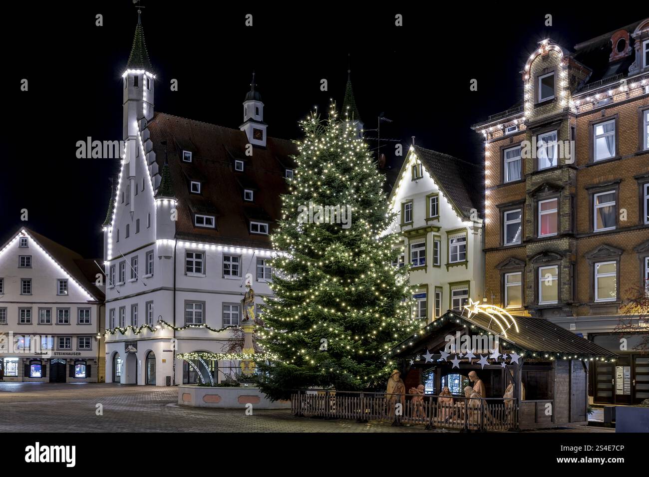 Night shot of historic buildings around the market square with ...