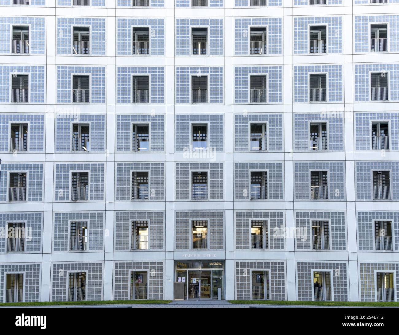 The facade with the entrance door and countless windows of the cube ...